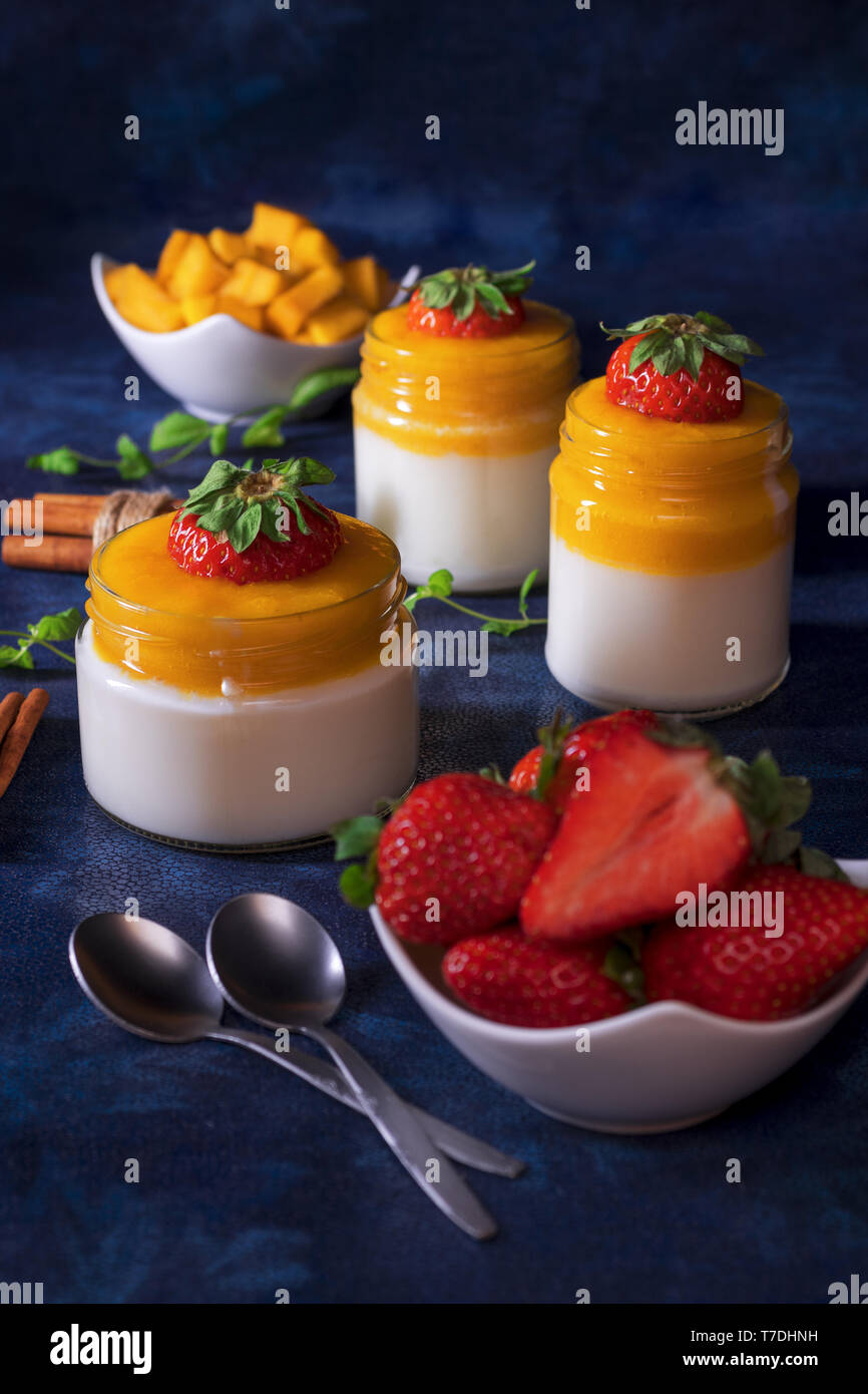 Traditional Italian sweet dessert Panna cotta with mango jelly served ...