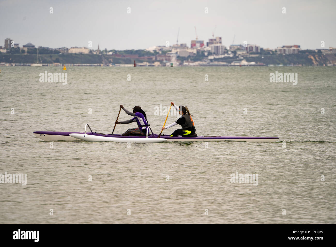 OC2 / V2 small outrigger canoes on the sea at Studland Bay, Dorset, UK ...