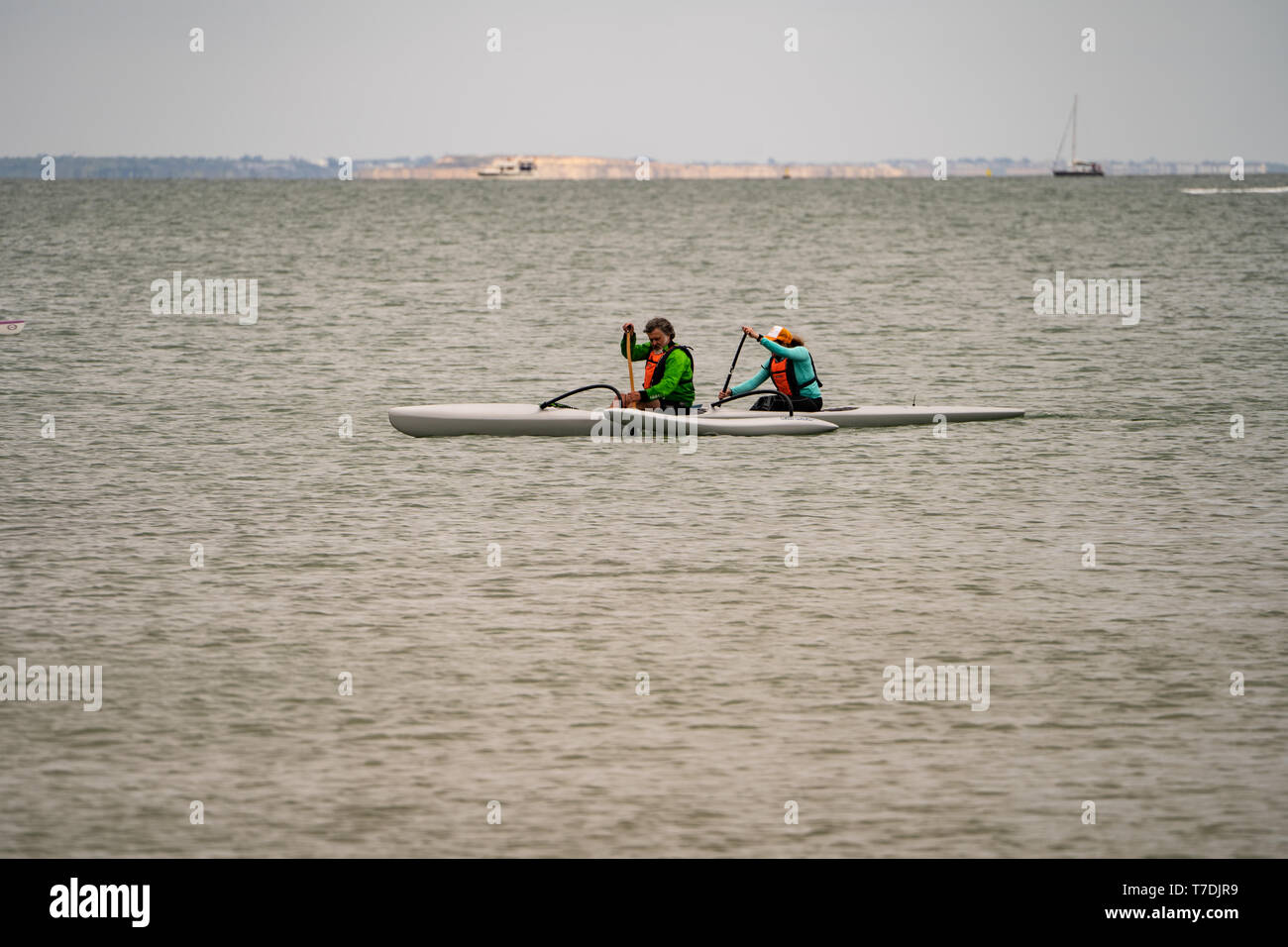 OC2 / V2 small outrigger canoes on the sea at Studland Bay, Dorset, UK ...