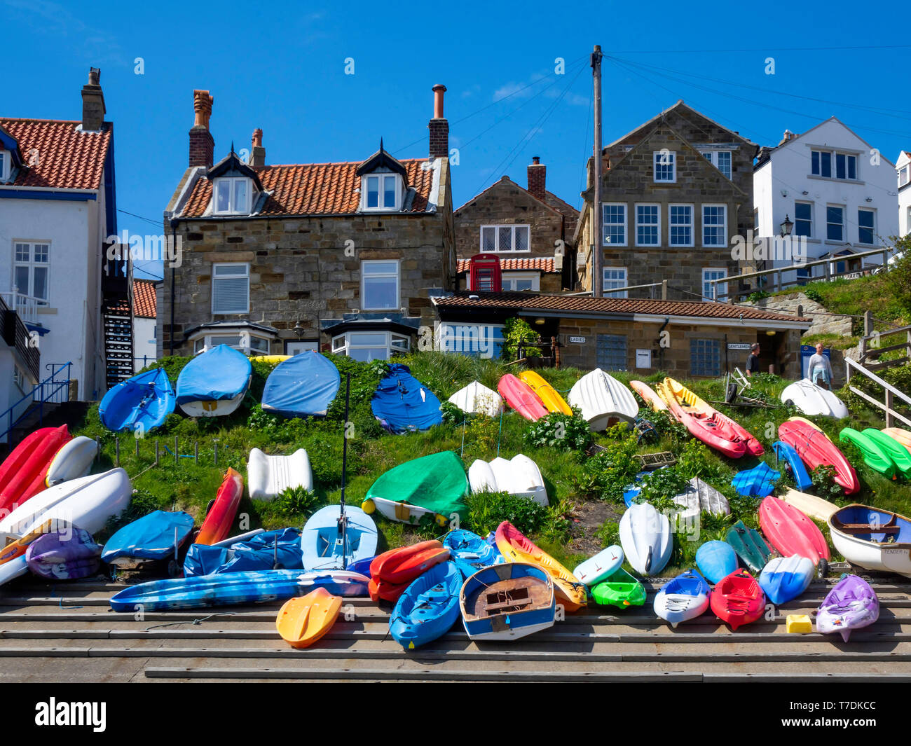 Small pleasure craft on the slipway in front of the village of Runswick ...