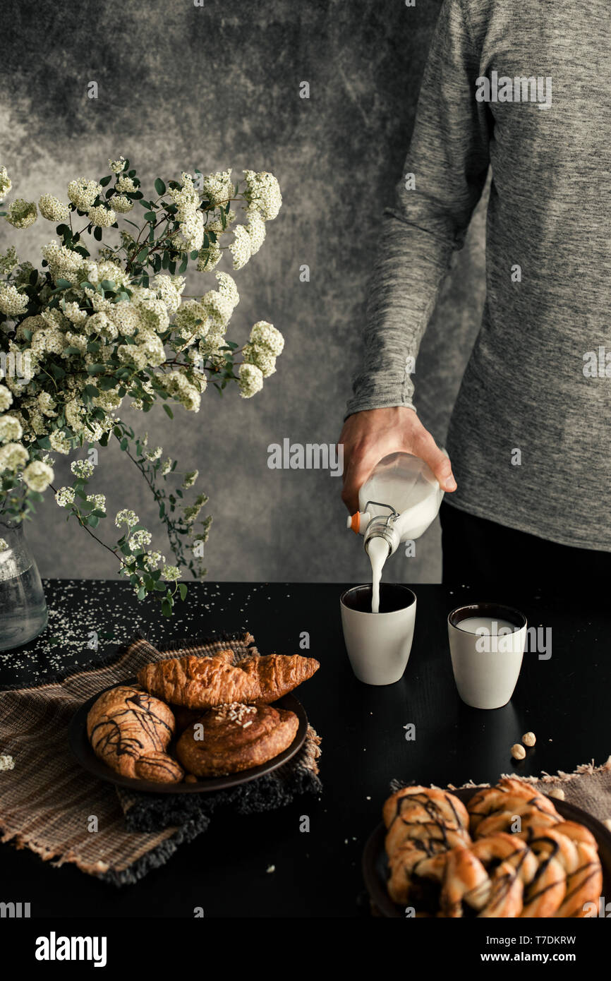 MAN POURING MILK ON A GLASS Stock Photo - Alamy
