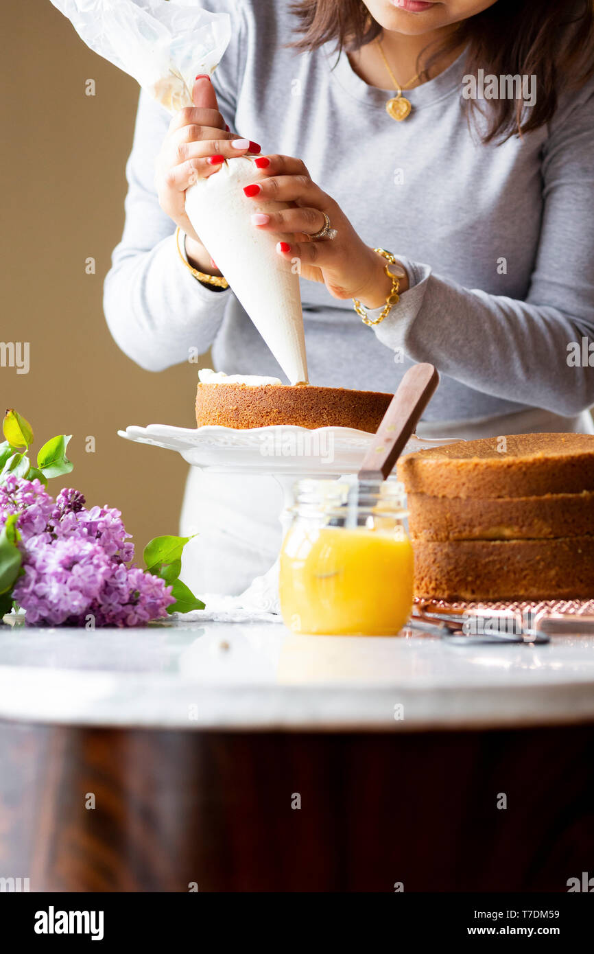Woman preparing a cake Stock Photo - Alamy