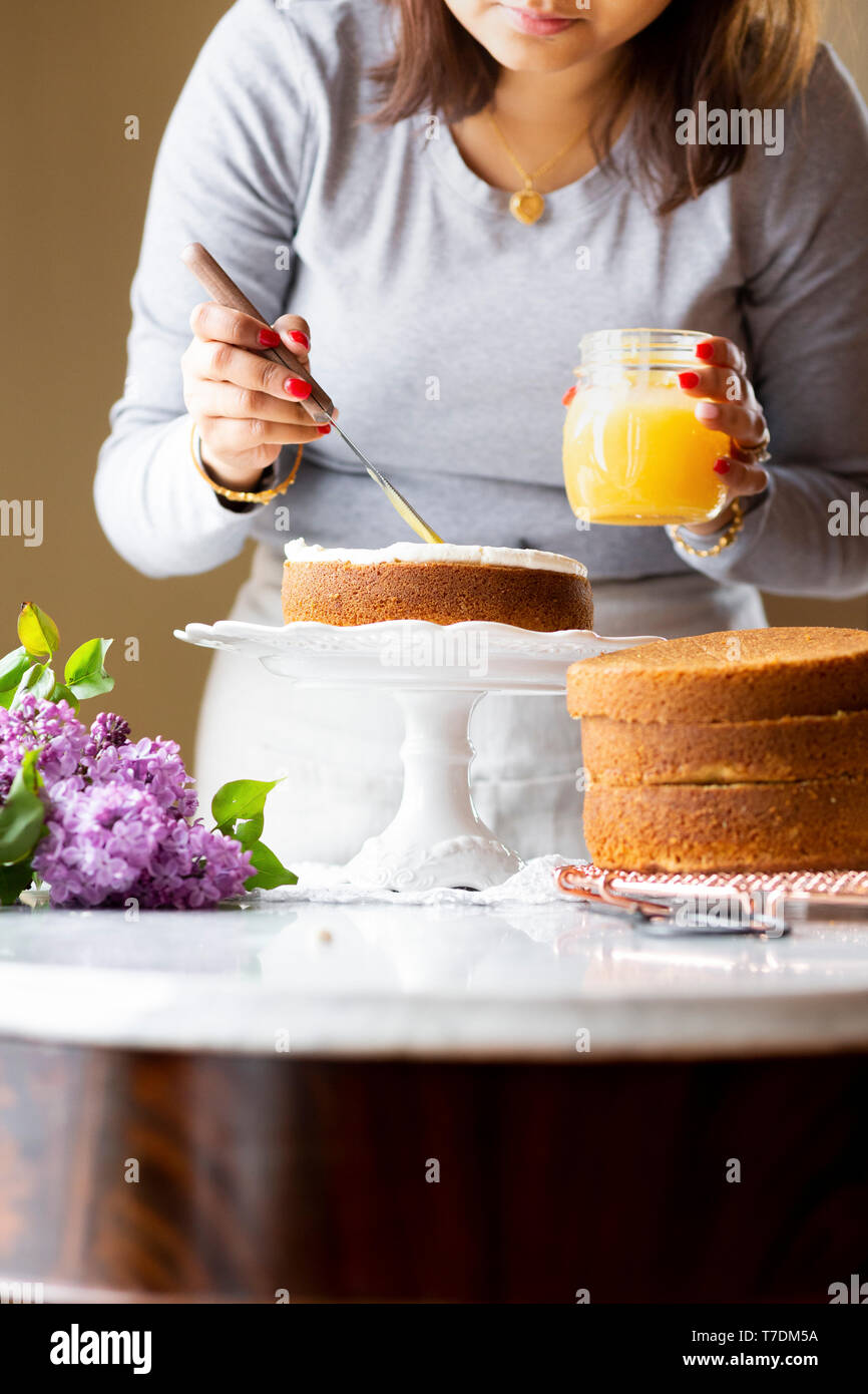 Woman preparing a cake Stock Photo - Alamy