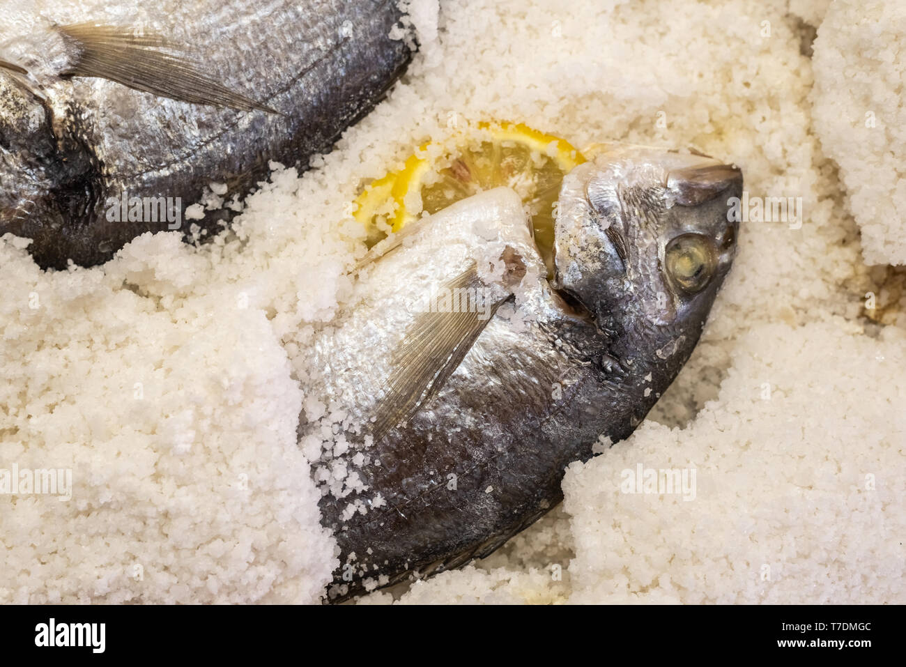 Gilt-head bream, Sparus aurata fish, prepared in the oven with salt ...