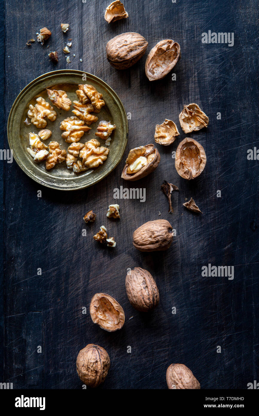 Walnuts with shells over black background, healthy natural food Stock ...