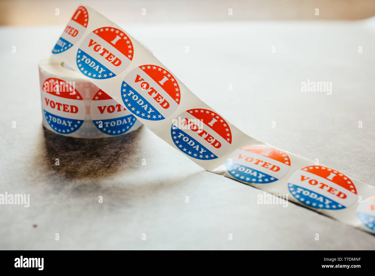 Roll of "I voted" circular stickers on a gray background for the ...