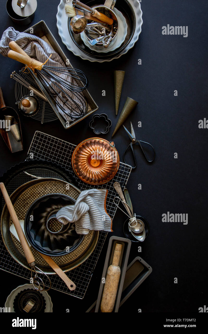Baking and patisserie equipment over black background with copy space ...