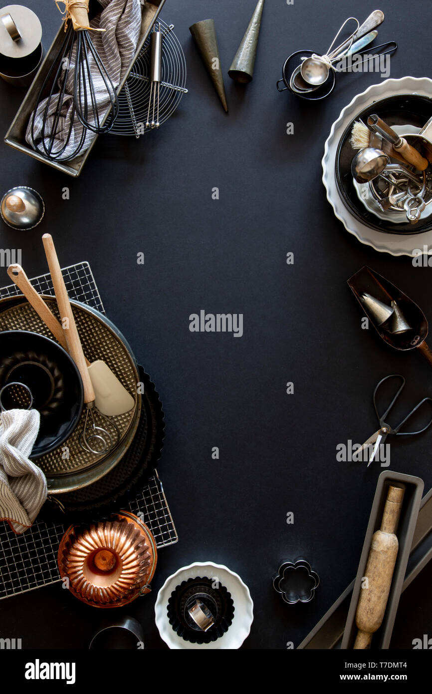 Baking and patisserie equipment over black background with copy space ...