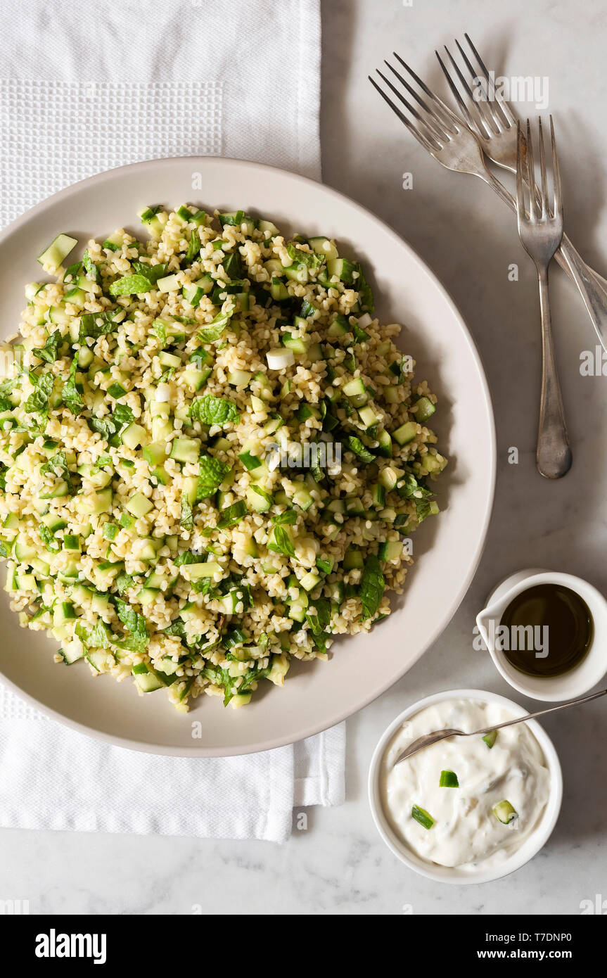 Cucumber tabbouleh salad with tzatziki dressing Stock Photo - Alamy