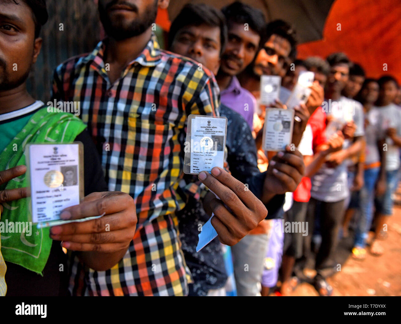 Voters seen with their Identity Cards before casting their Votes at a ...