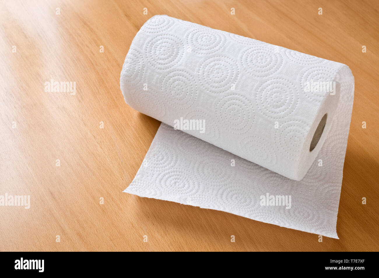 Paper towel roll on the table Stock Photo - Alamy