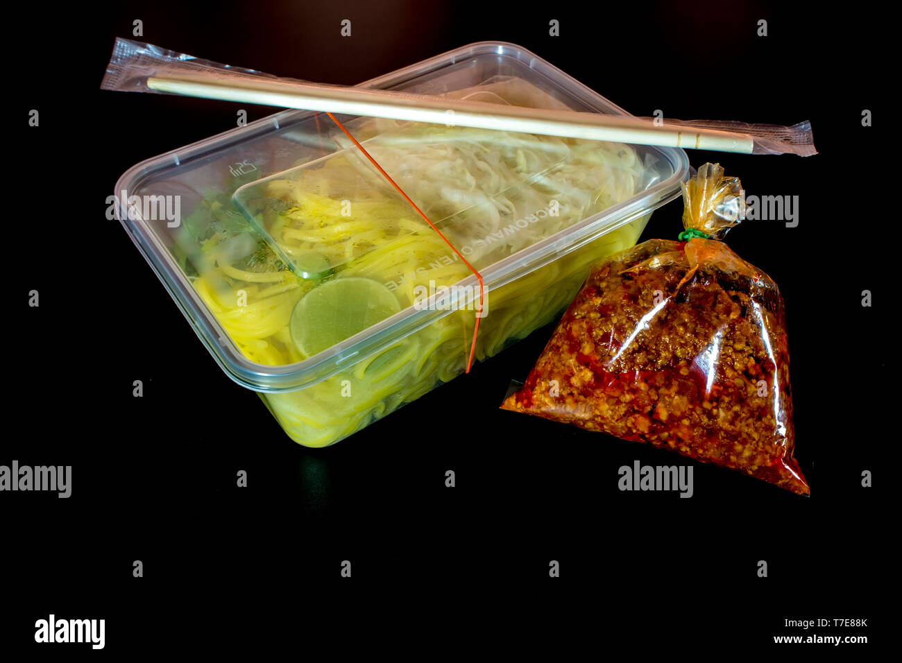 Spaghetti with sauce / Take home food in plastic packaging Stock Photo ...