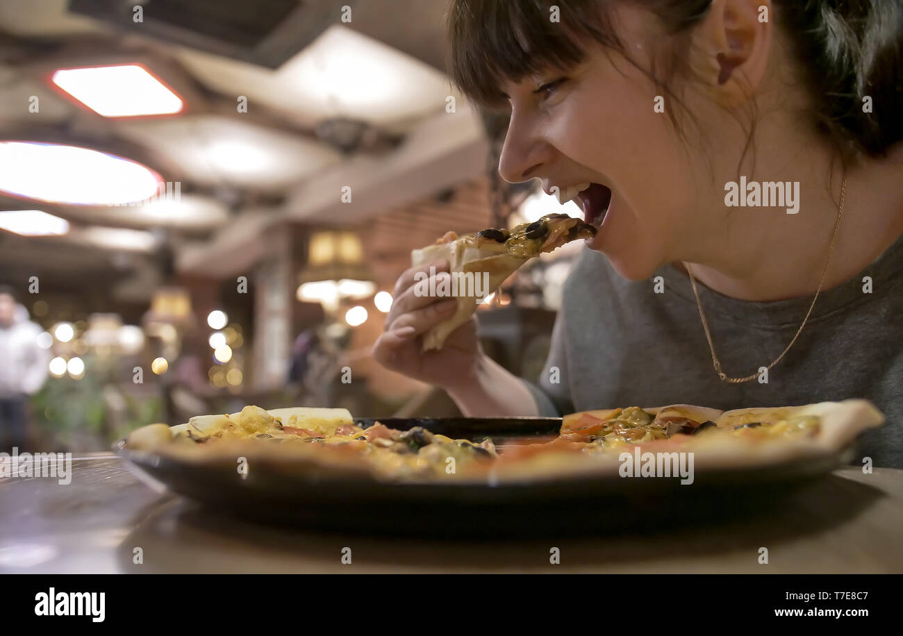 Woman eating big piece of cheese hi-res stock photography and images ...