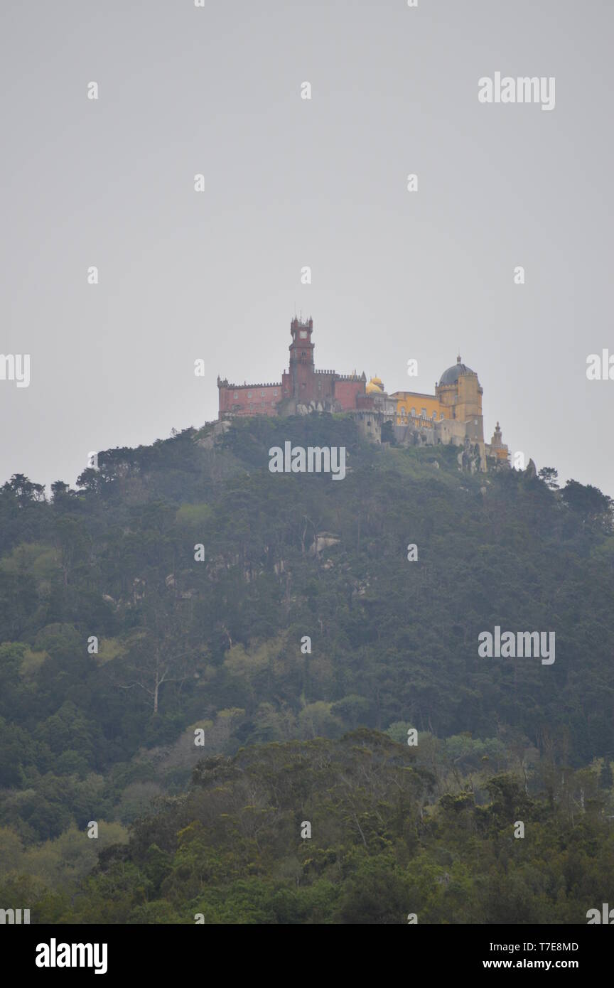 Wonderful Views Of The Palace Of Pena At The Top Of A Cliff On A Cloudy ...