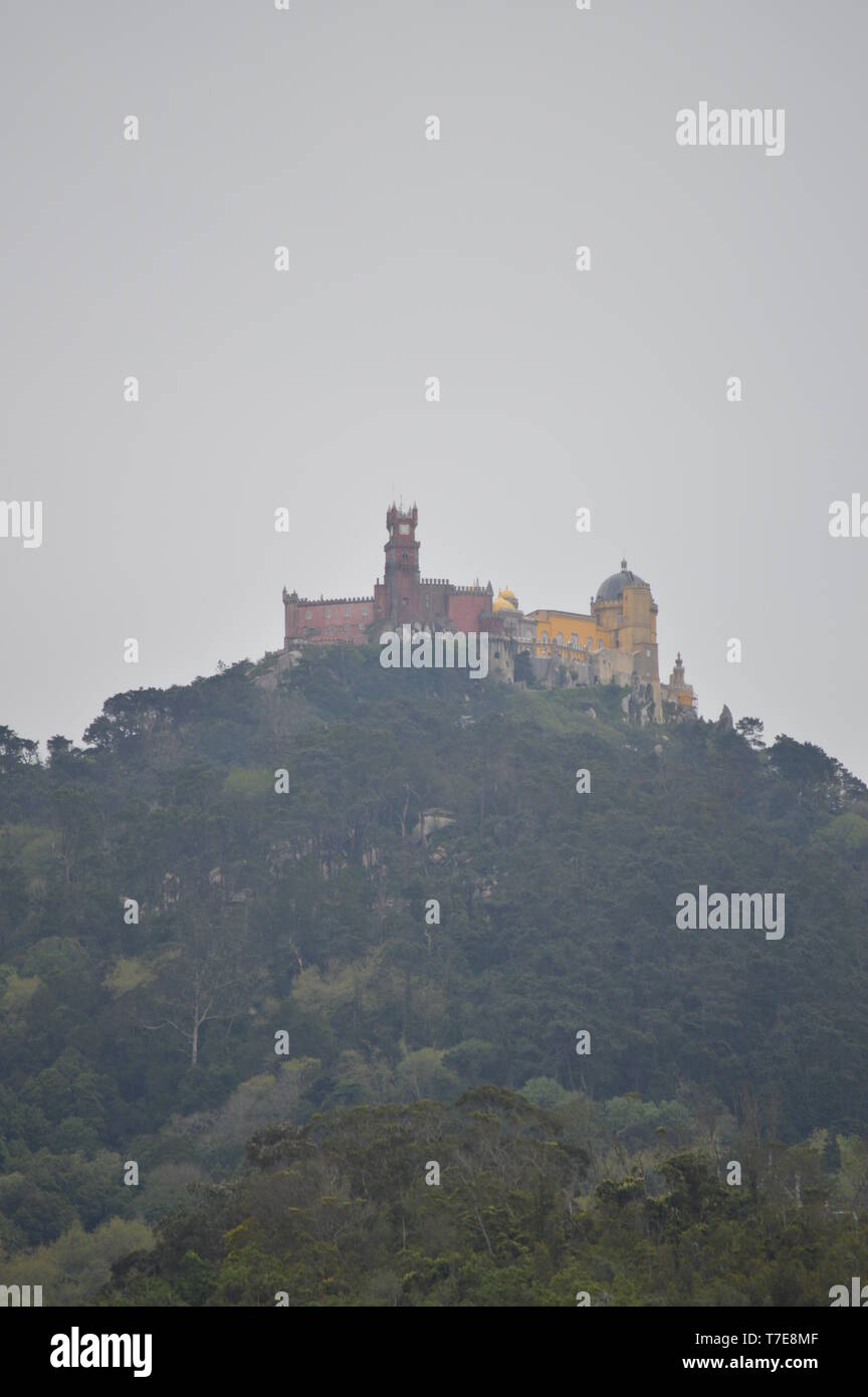 Wonderful Views Of The Palace Of Pena At The Top Of A Cliff On A Cloudy ...