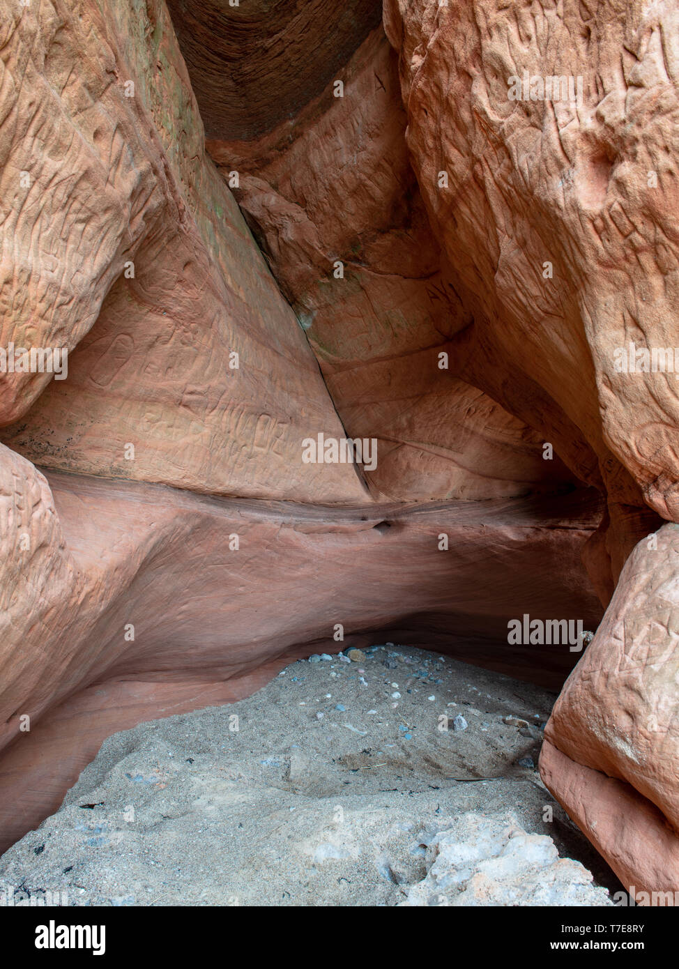 sandstone cave entrance in dark. sand covered ground. latvia Stock ...