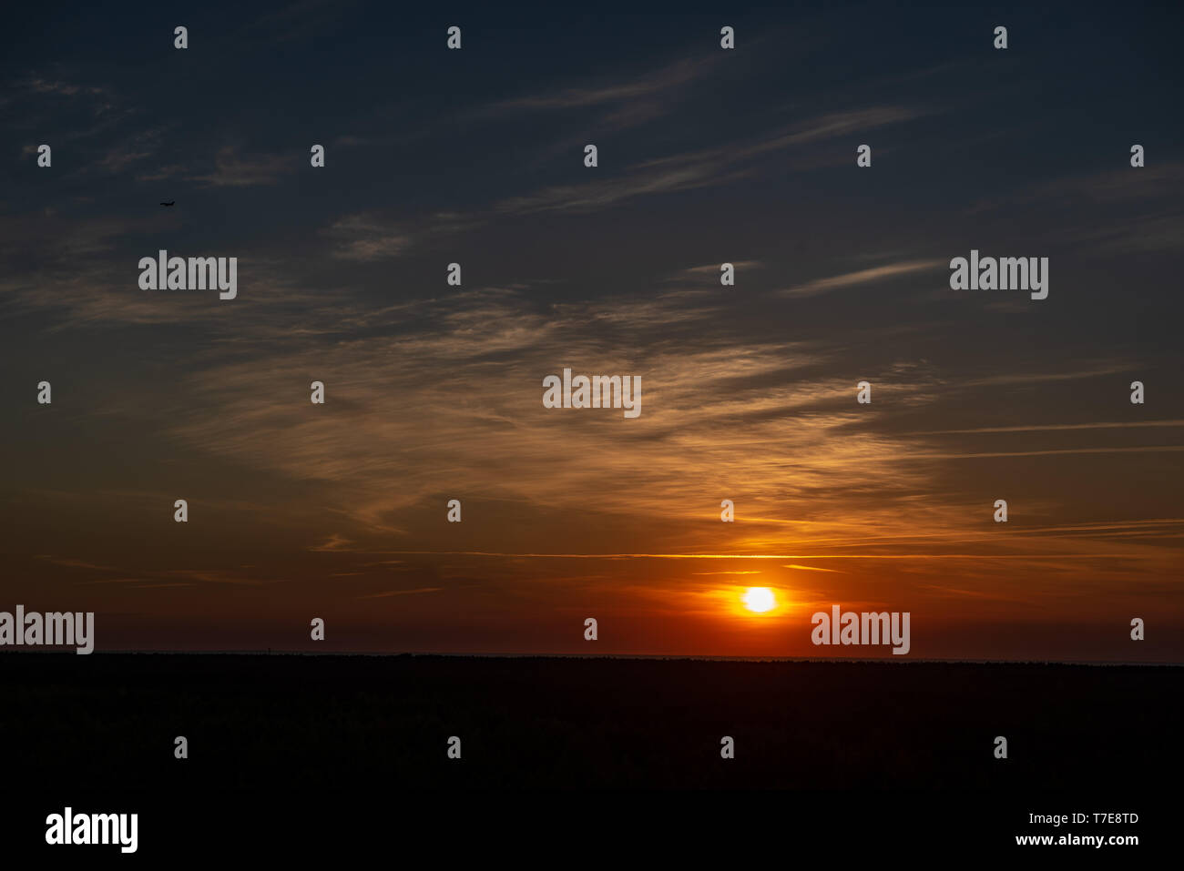 colorful sunset over the sea lake with dark red clouds in summer Stock ...