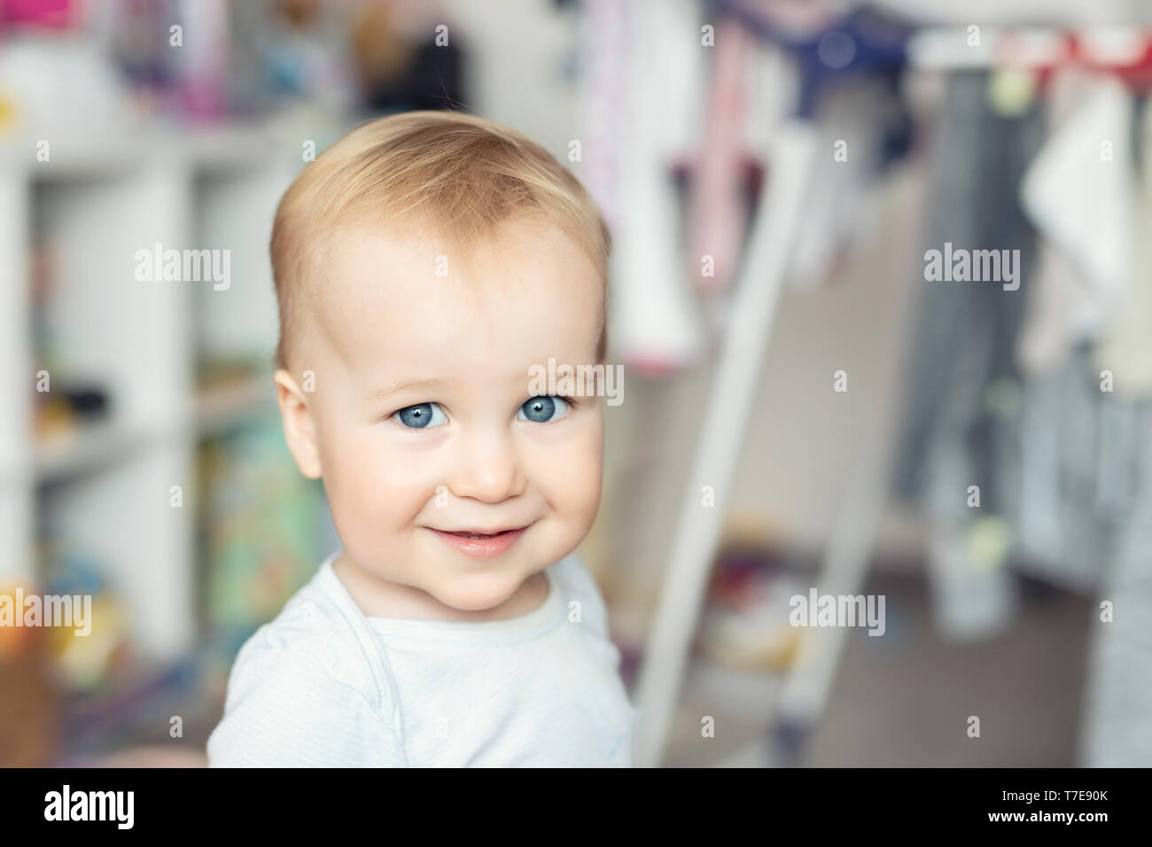 Cute adorable caucasian toodler boy laughing and having fun playing ...