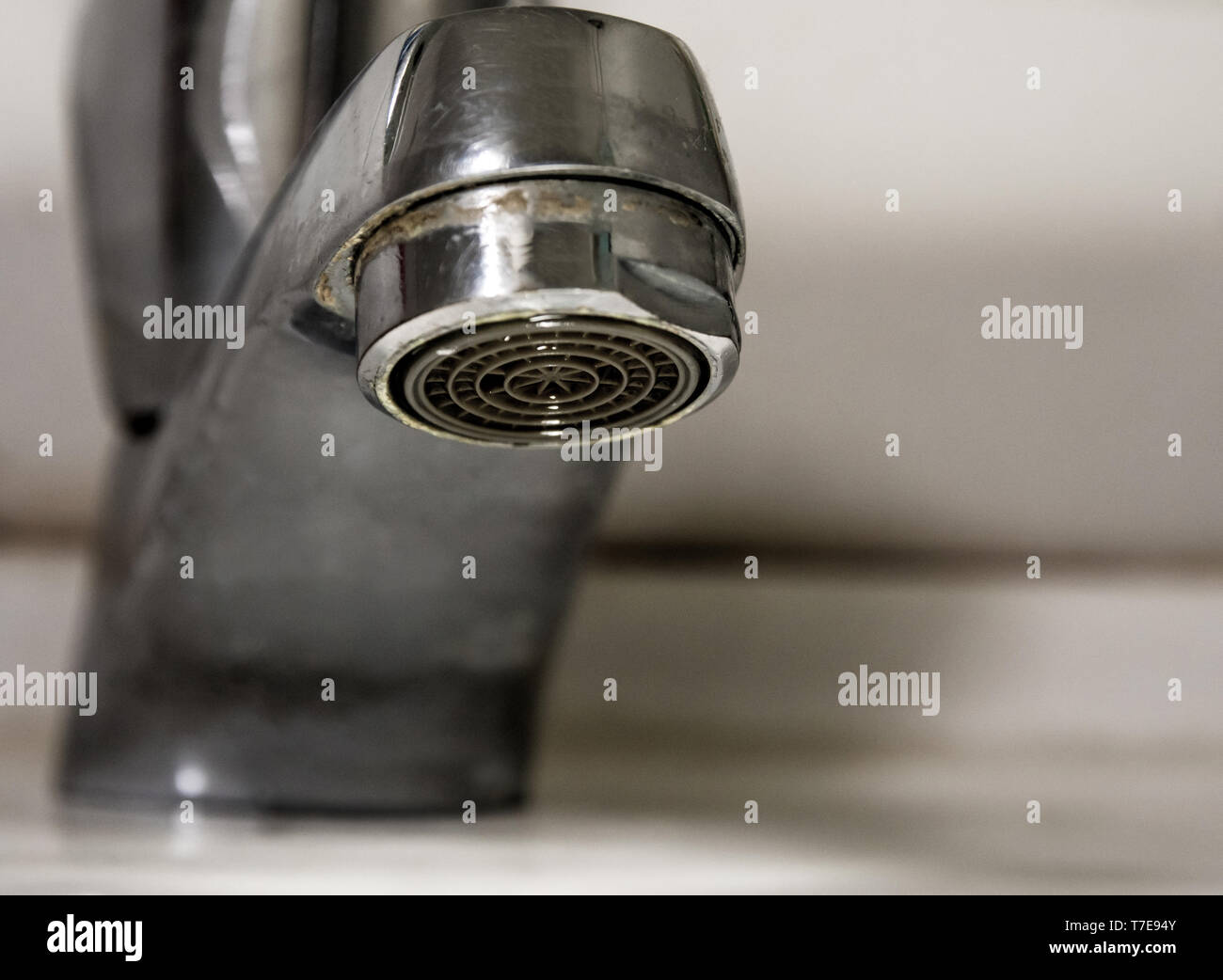 Leaking water drops from old rust and stained faucet, Save water ...