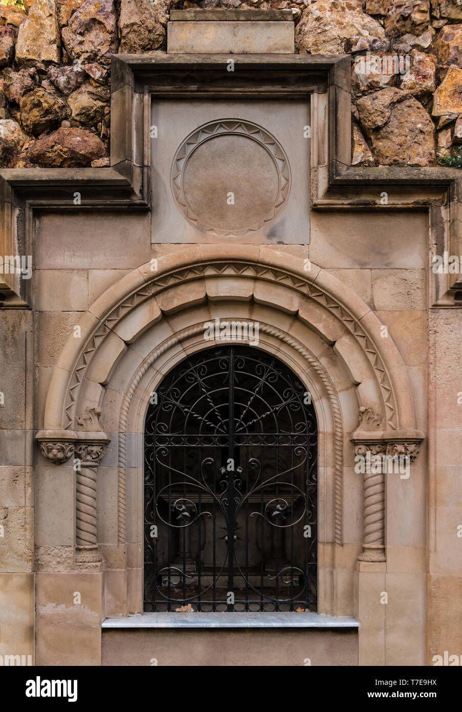 The door of the stone crypt on the Montjuic Cemetery closeup front view ...
