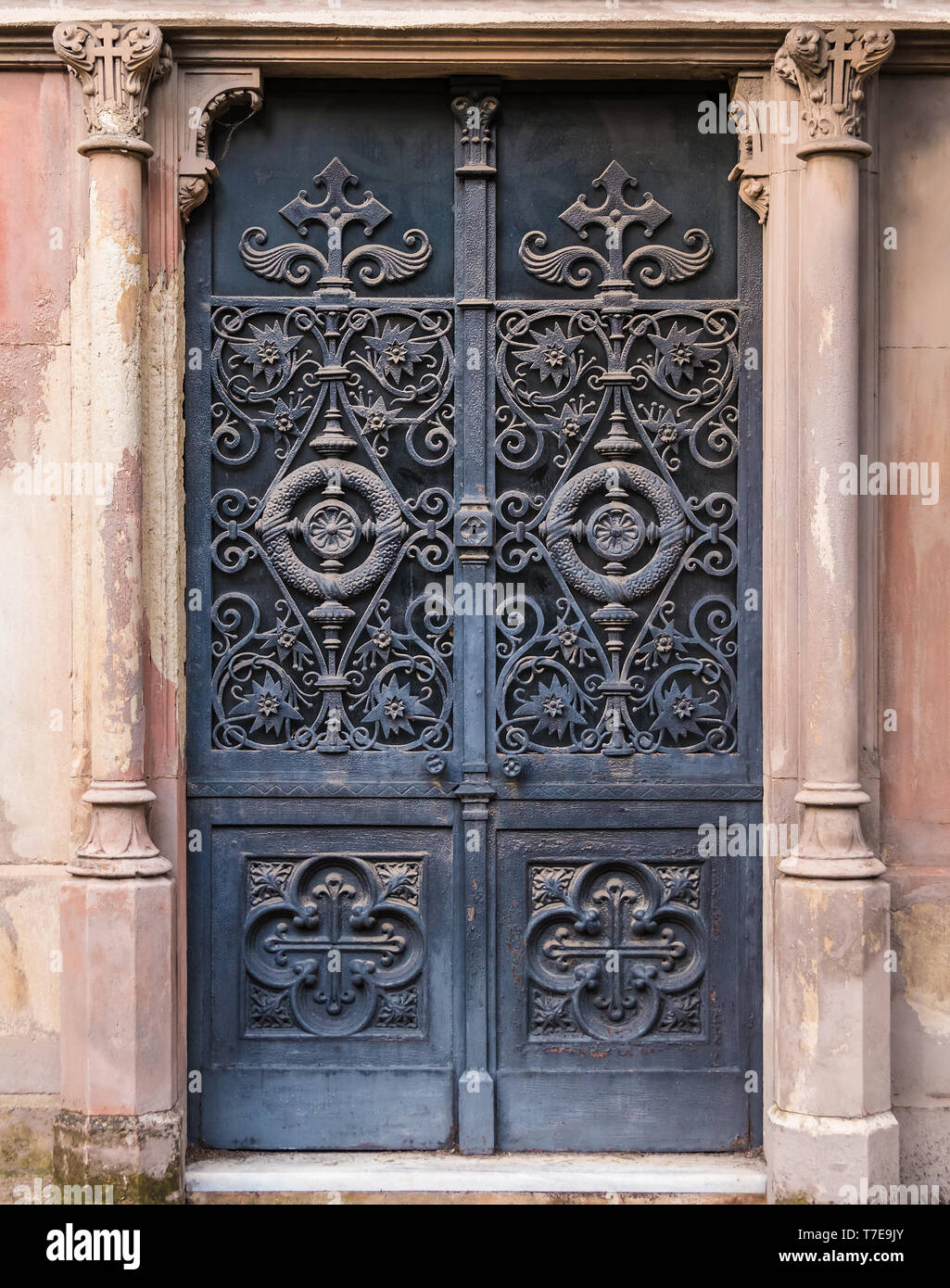 The wrought door of the stone crypt on the Montjuic Cemetery closeup ...