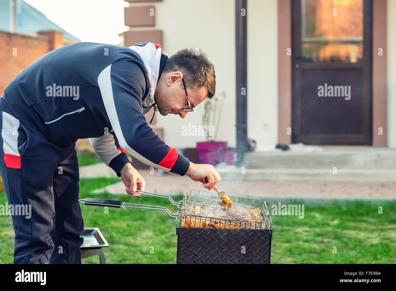 Man eating chicken wings hi-res stock photography and images - Alamy