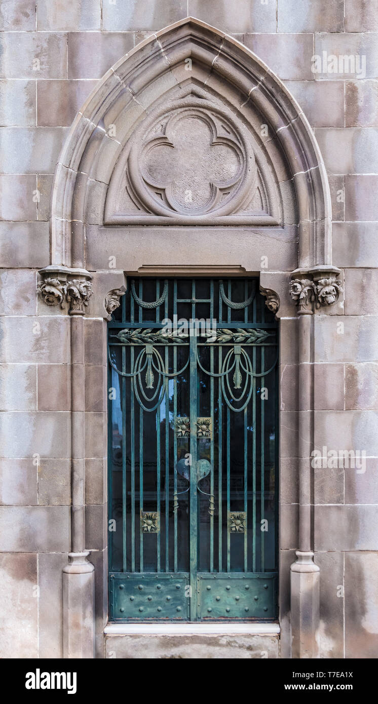 The door of the stone crypt on the Montjuic Cemetery closeup front view ...