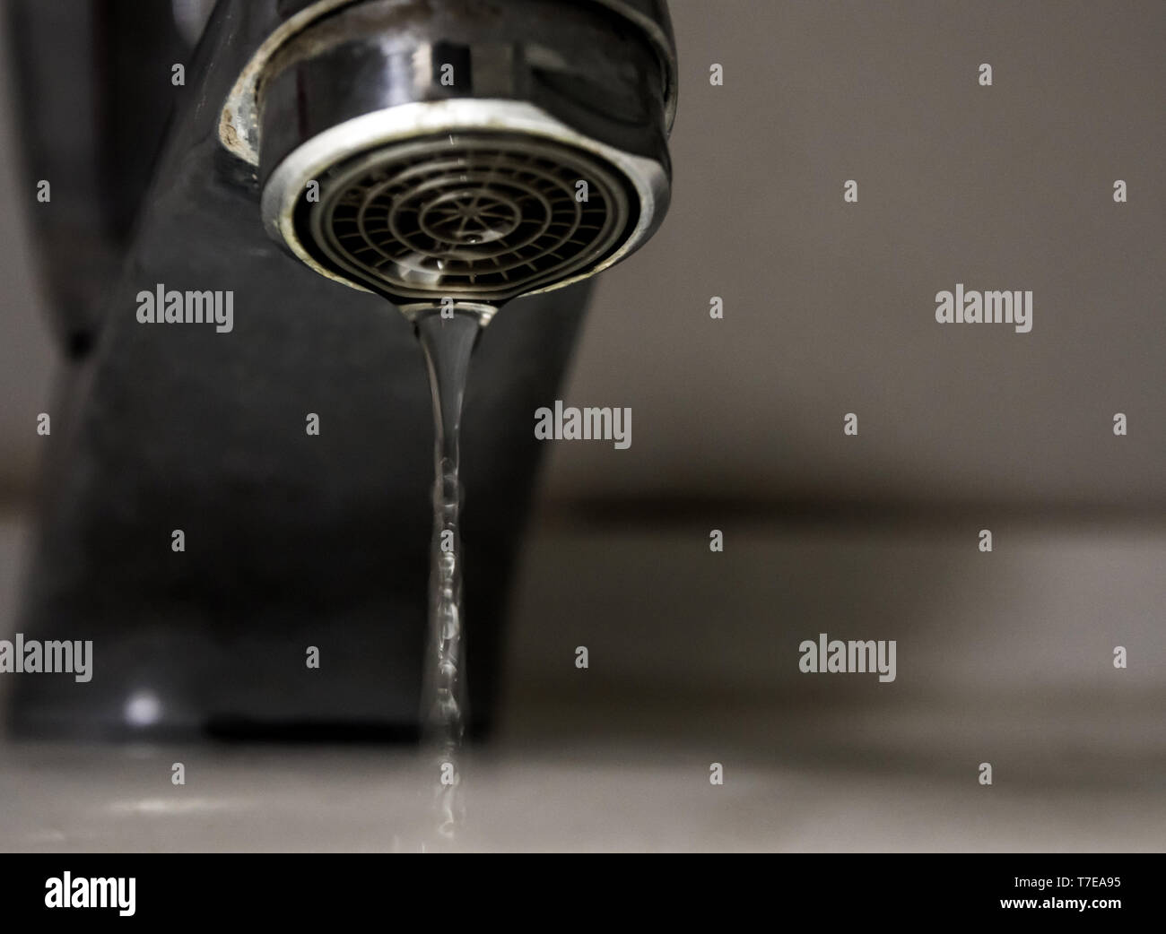 Leaking water drops from old rust and stained faucet, Save water ...