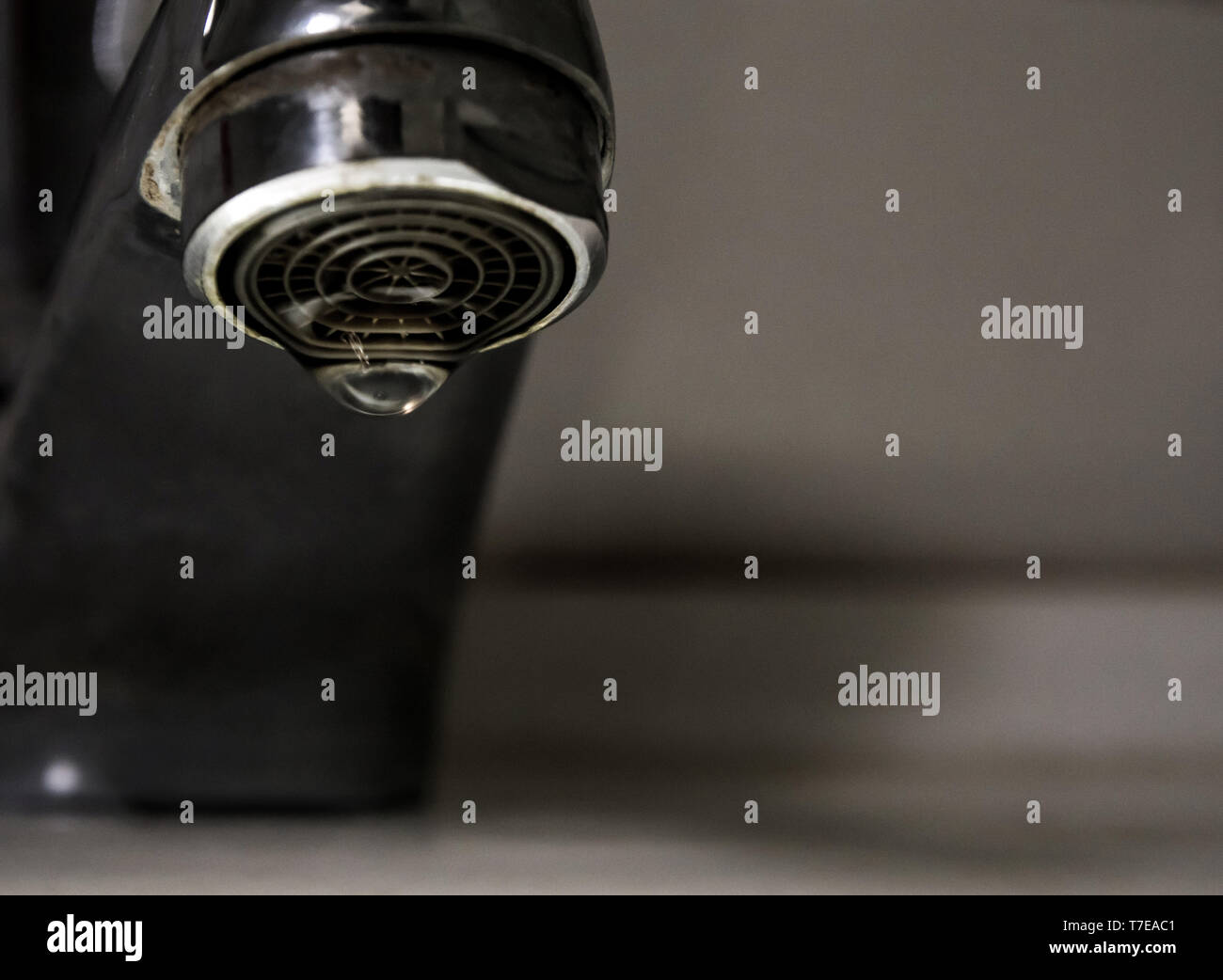 Leaking water drops from old rust and stained faucet, Save water ...