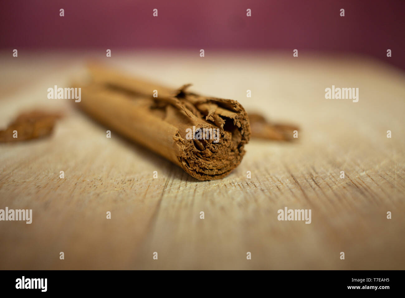 Cinnamon on Wooden Chopping Board Stock Photo - Alamy