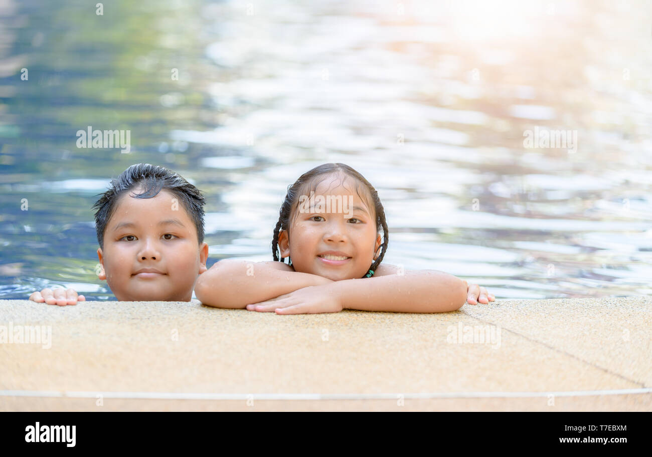 Brother And Sister Swimming Together High Resolution Stock Photography ...