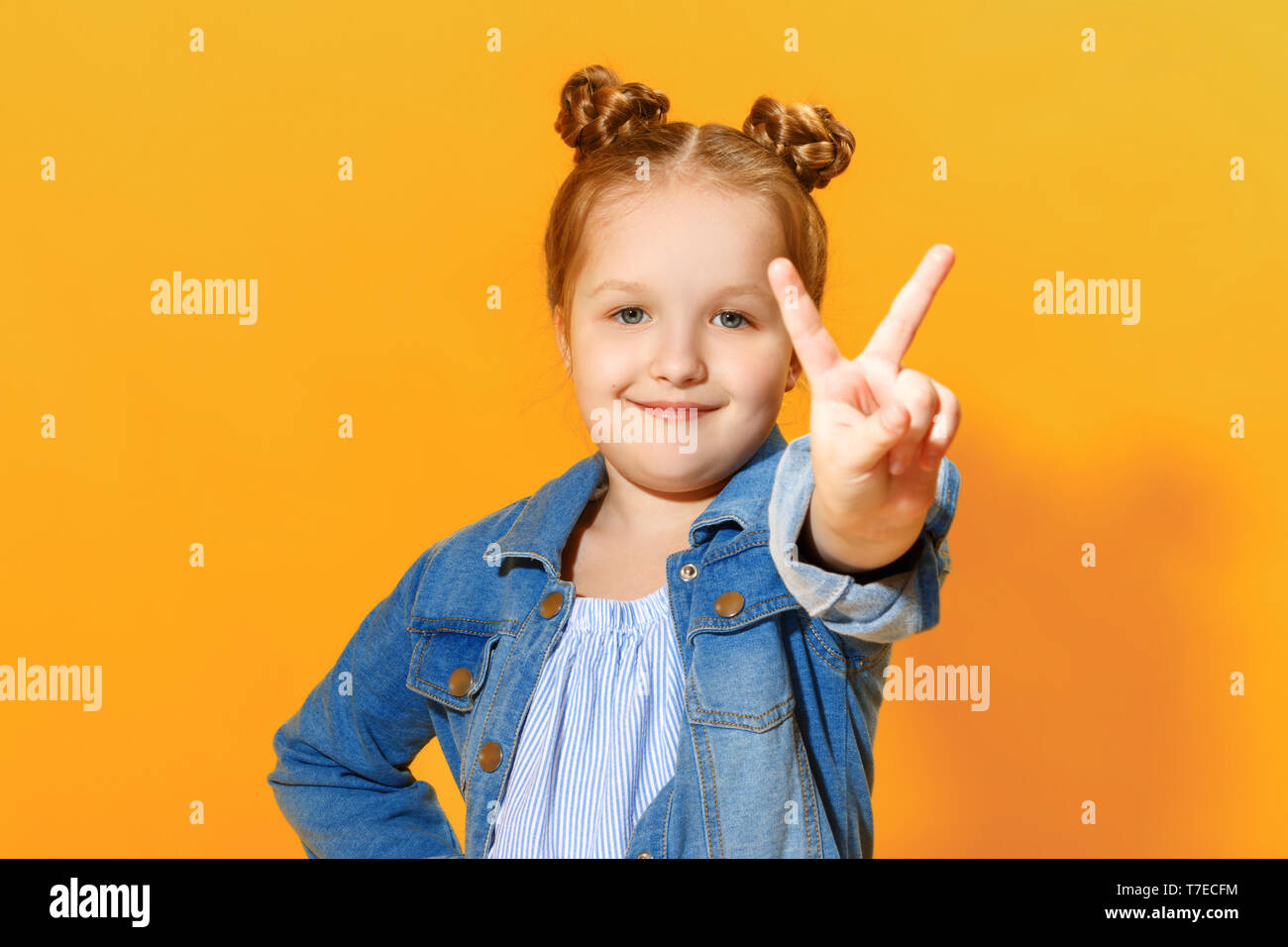 Child girl showing victory hand hi-res stock photography and images - Alamy