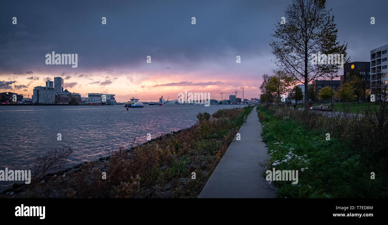 colorful Sunset over amsterdam waterfront in the netherlands Stock ...