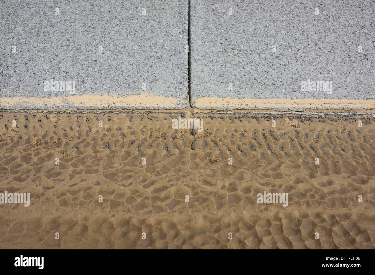 Expansion joint between two precast concrete panels at base of sloping ...