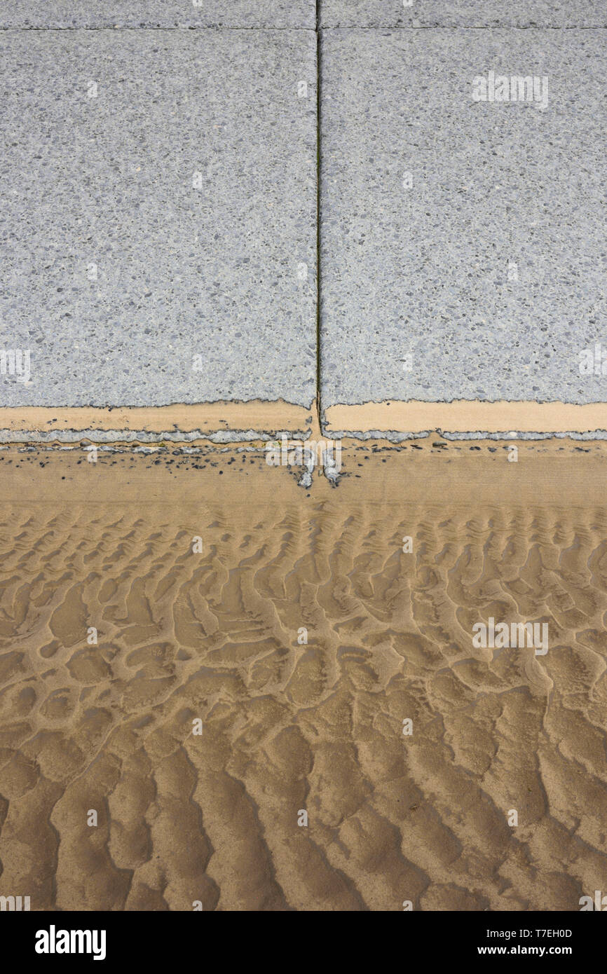 Expansion joint between two precast concrete panels at base of sloping ...