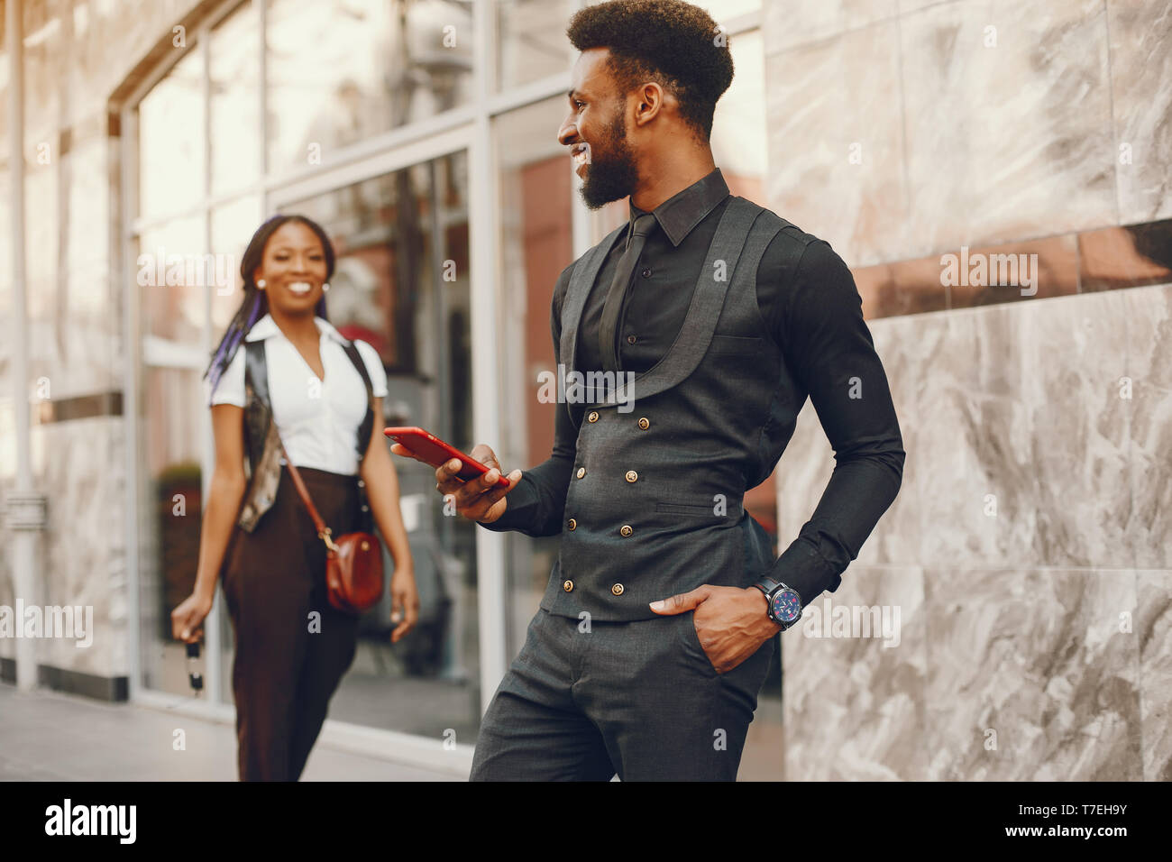 A stylish and beautiful dark-skinned couple in a city Stock Photo - Alamy