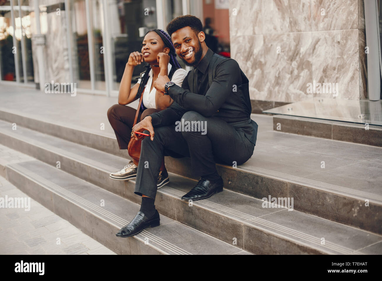 A stylish and beautiful dark-skinned couple in a city Stock Photo - Alamy