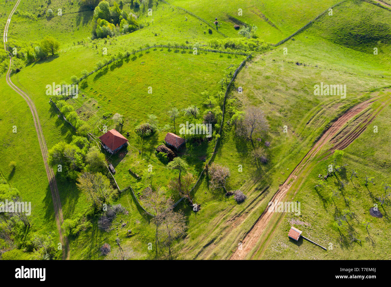 Aerial view of a countryside homestead houses in the mountains by drone ...