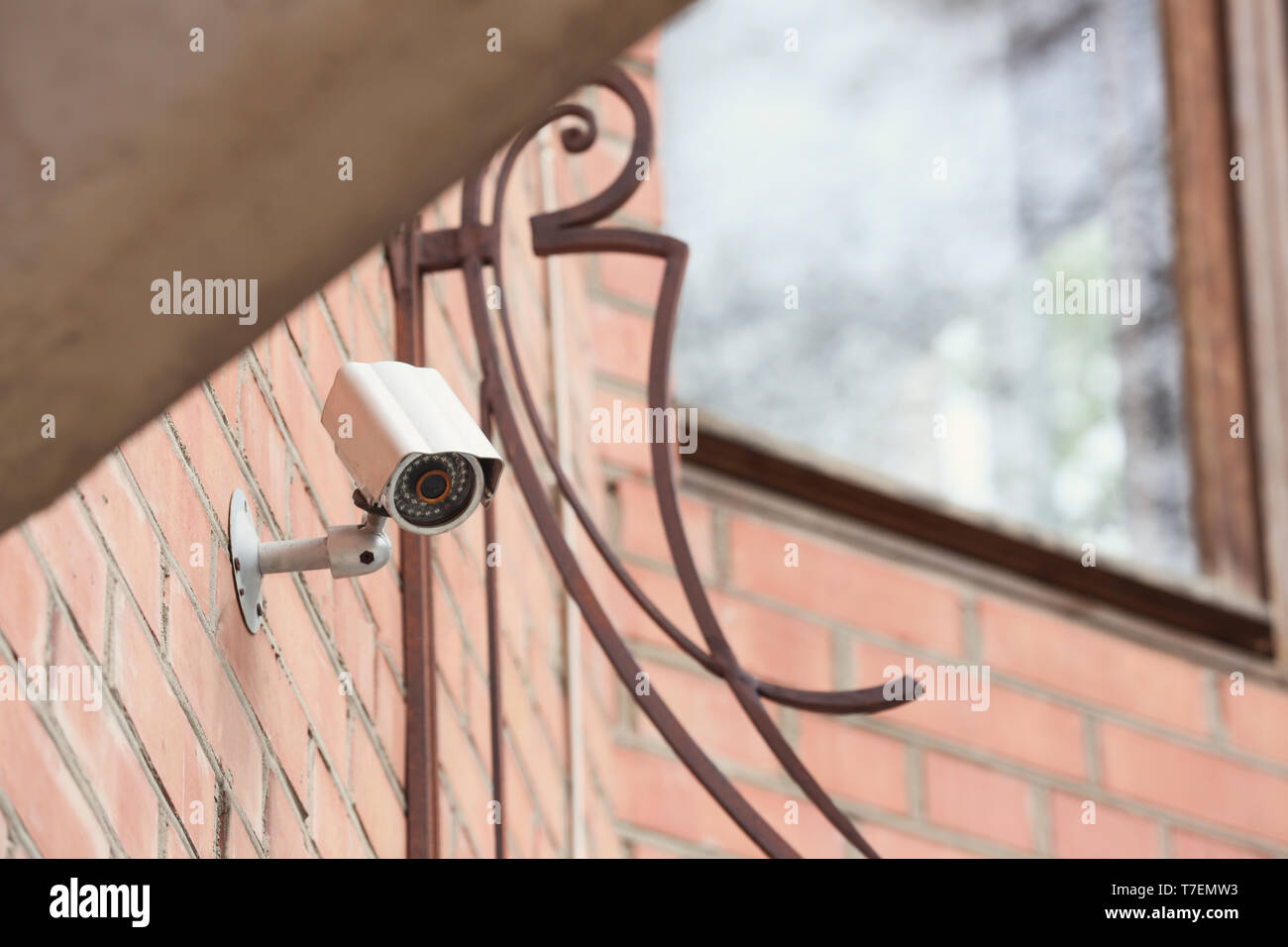 Modern CCTV camera installed on wall of building outdoors Stock Photo ...