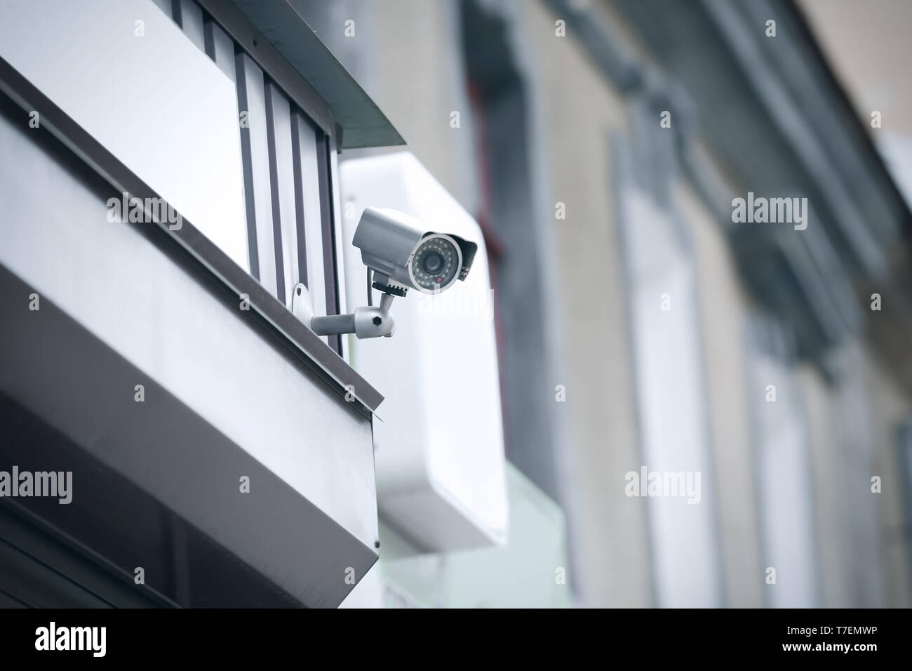 Modern CCTV camera installed on wall of building outdoors Stock Photo ...
