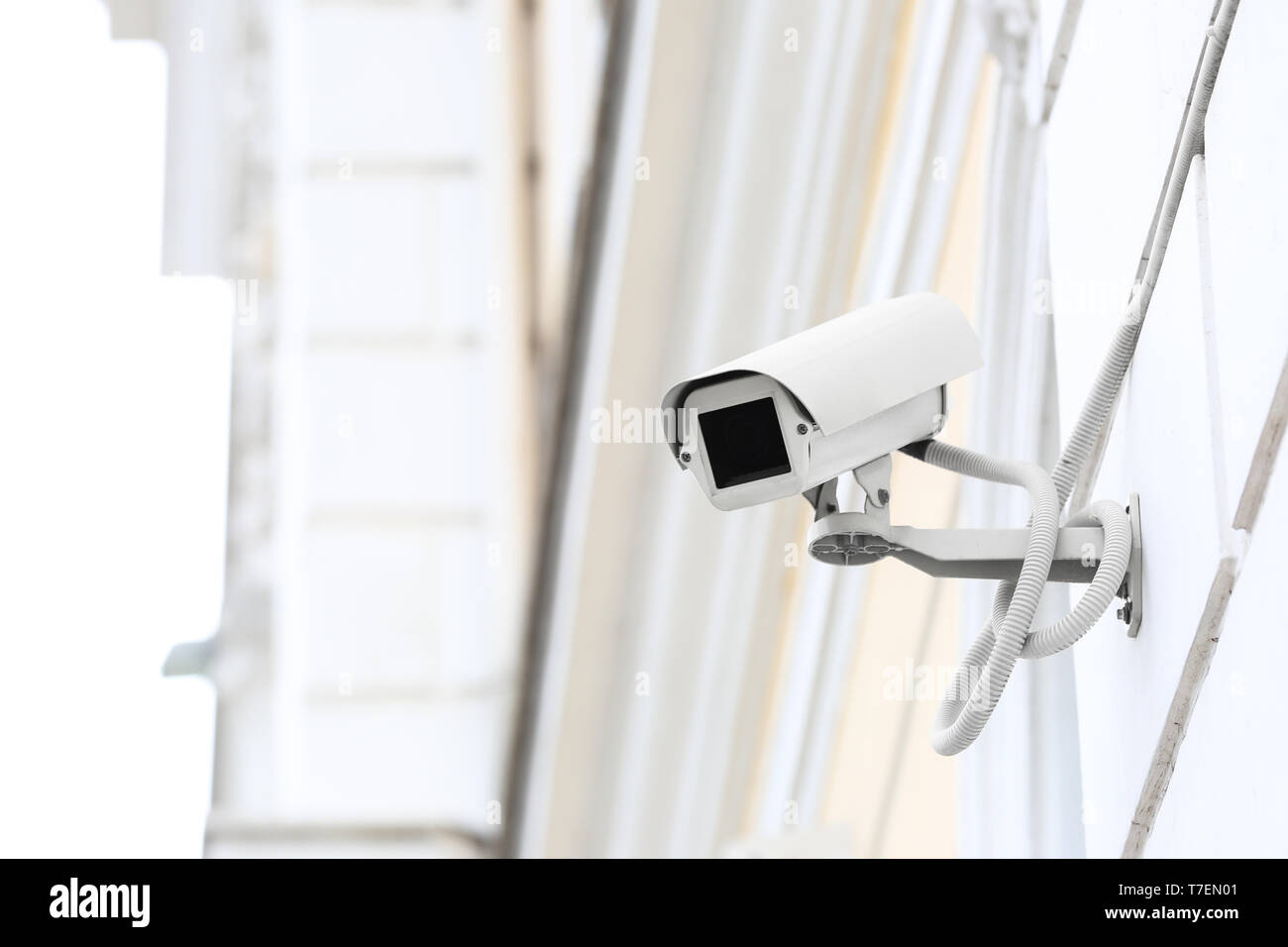 Modern CCTV camera installed on wall of building outdoors Stock Photo ...