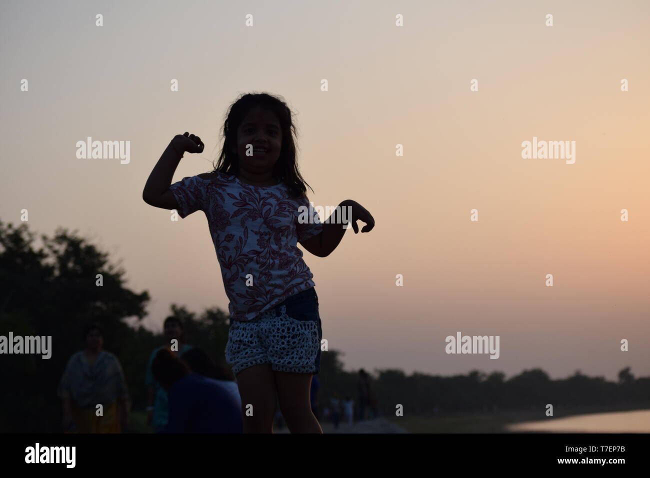 Girl having fun at lake Stock Photo - Alamy