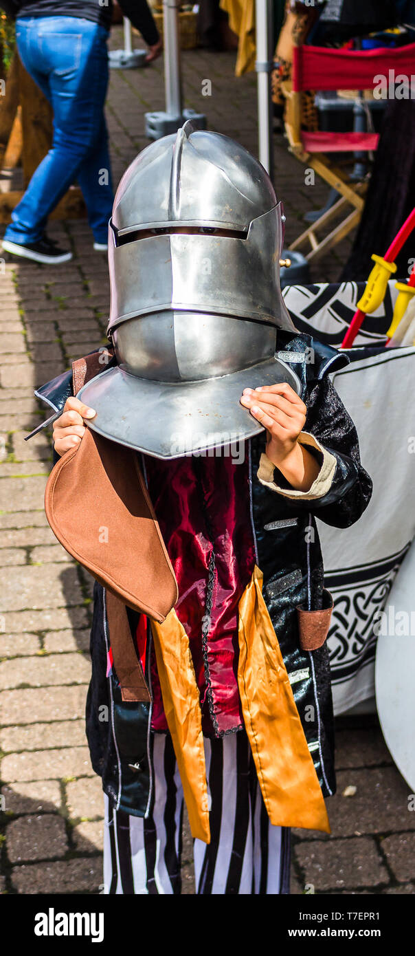 Child wearing a very big helmet Stock Photo - Alamy