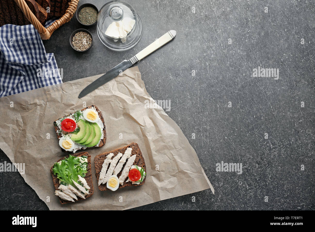 Composition with delicious toasts on table Stock Photo - Alamy