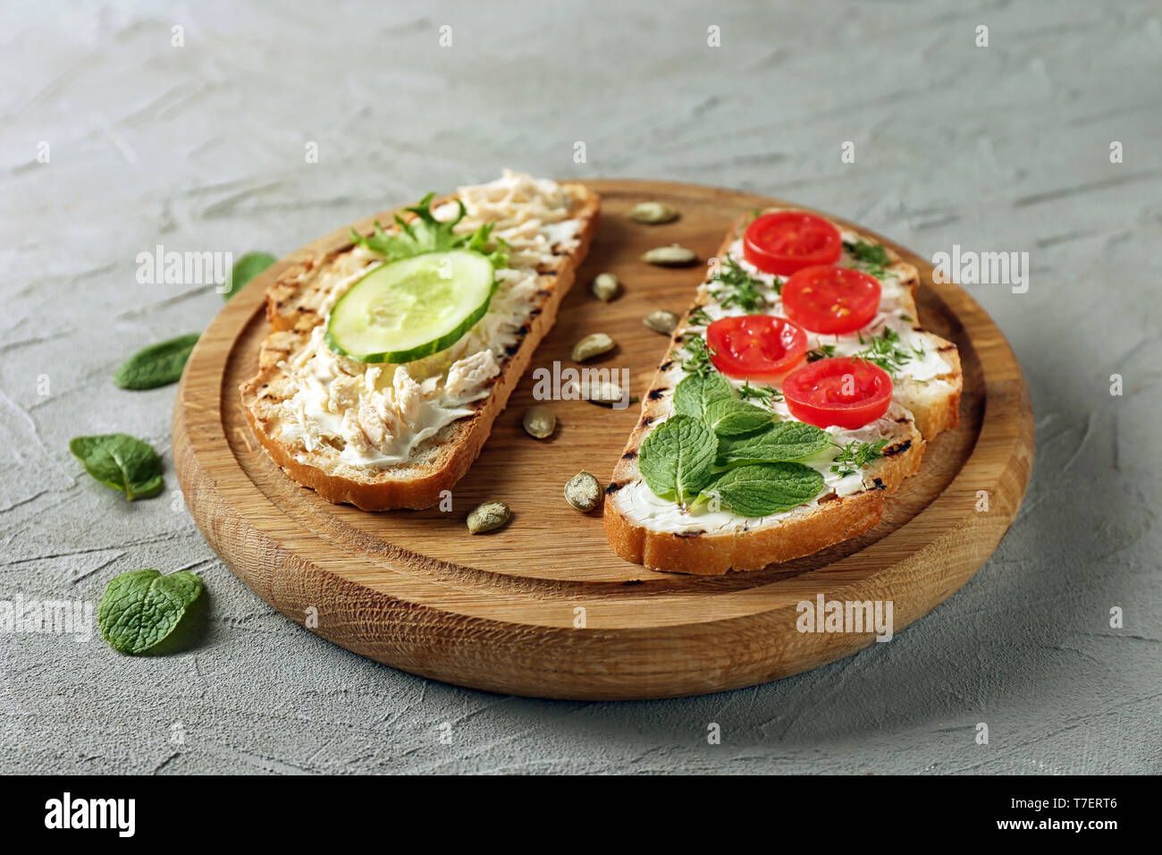 Delicious toasts on textured table Stock Photo - Alamy
