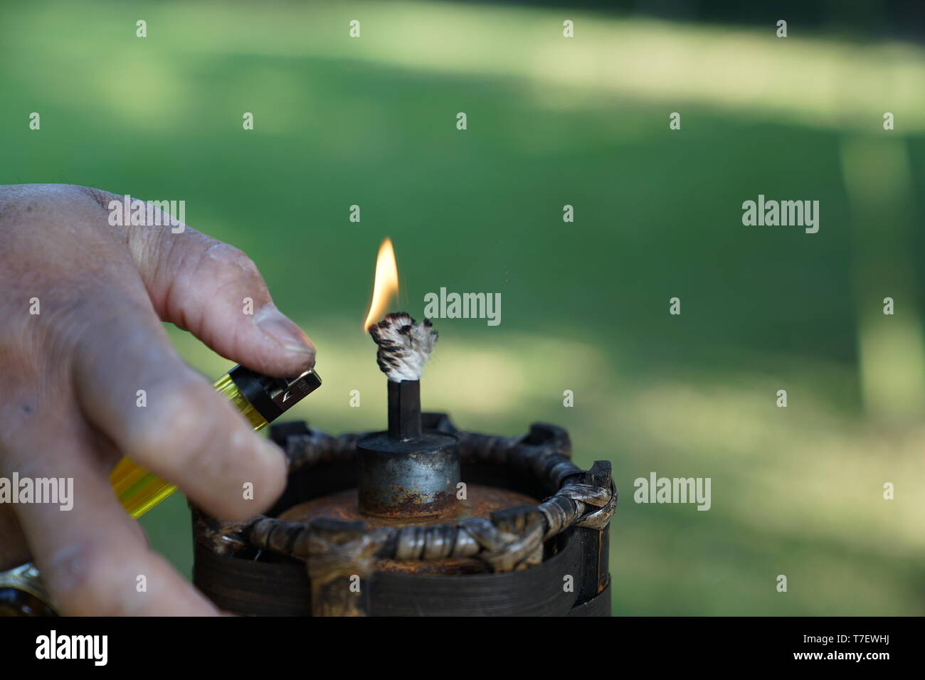 torch and fire in the morning garden Stock Photo - Alamy