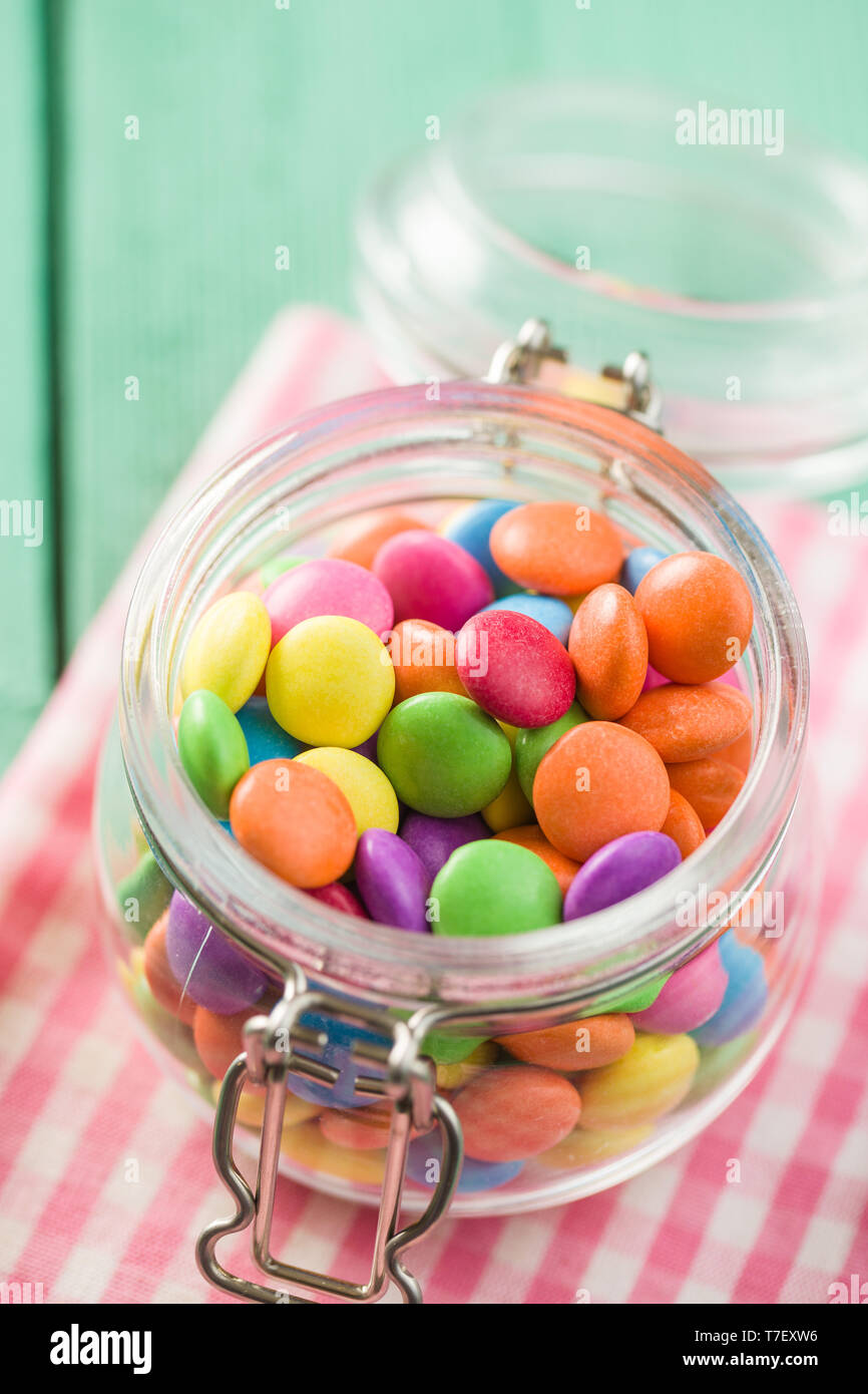 Colorful chocolate candy pills in jar Stock Photo - Alamy