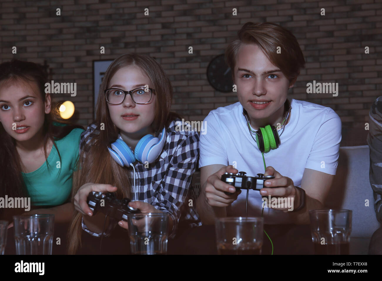 Teenagers playing video games night hi-res stock photography and images ...