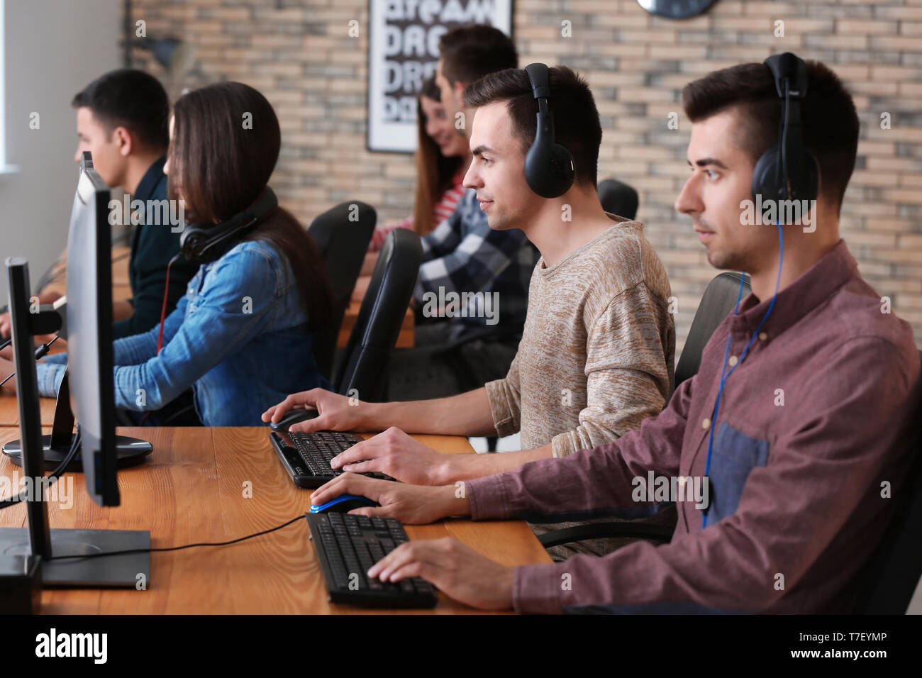 Young people playing video games at tournament Stock Photo - Alamy
