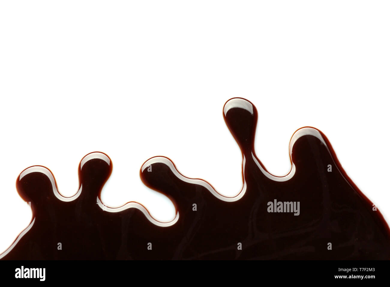 Chocolate syrup on white background Stock Photo - Alamy